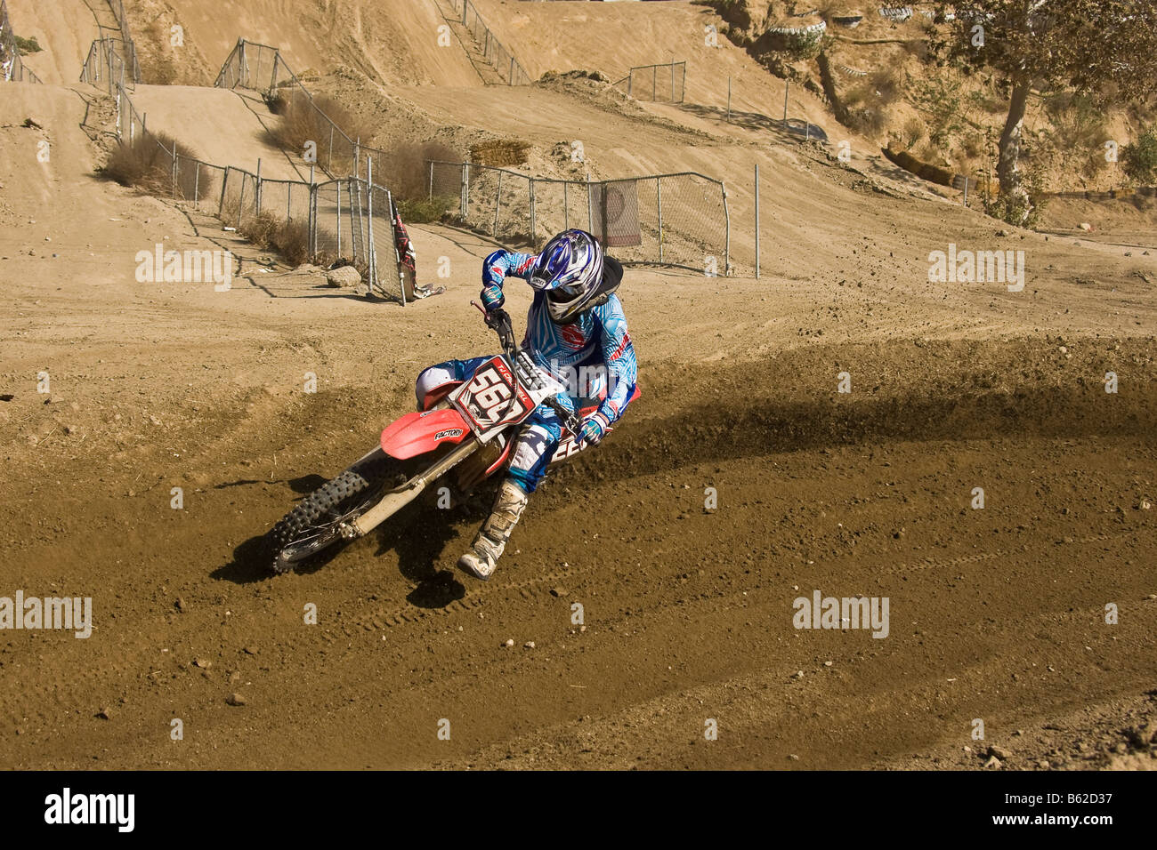 Motorcross rider sweeping through a bend at Glen Helen circuit Devore ...