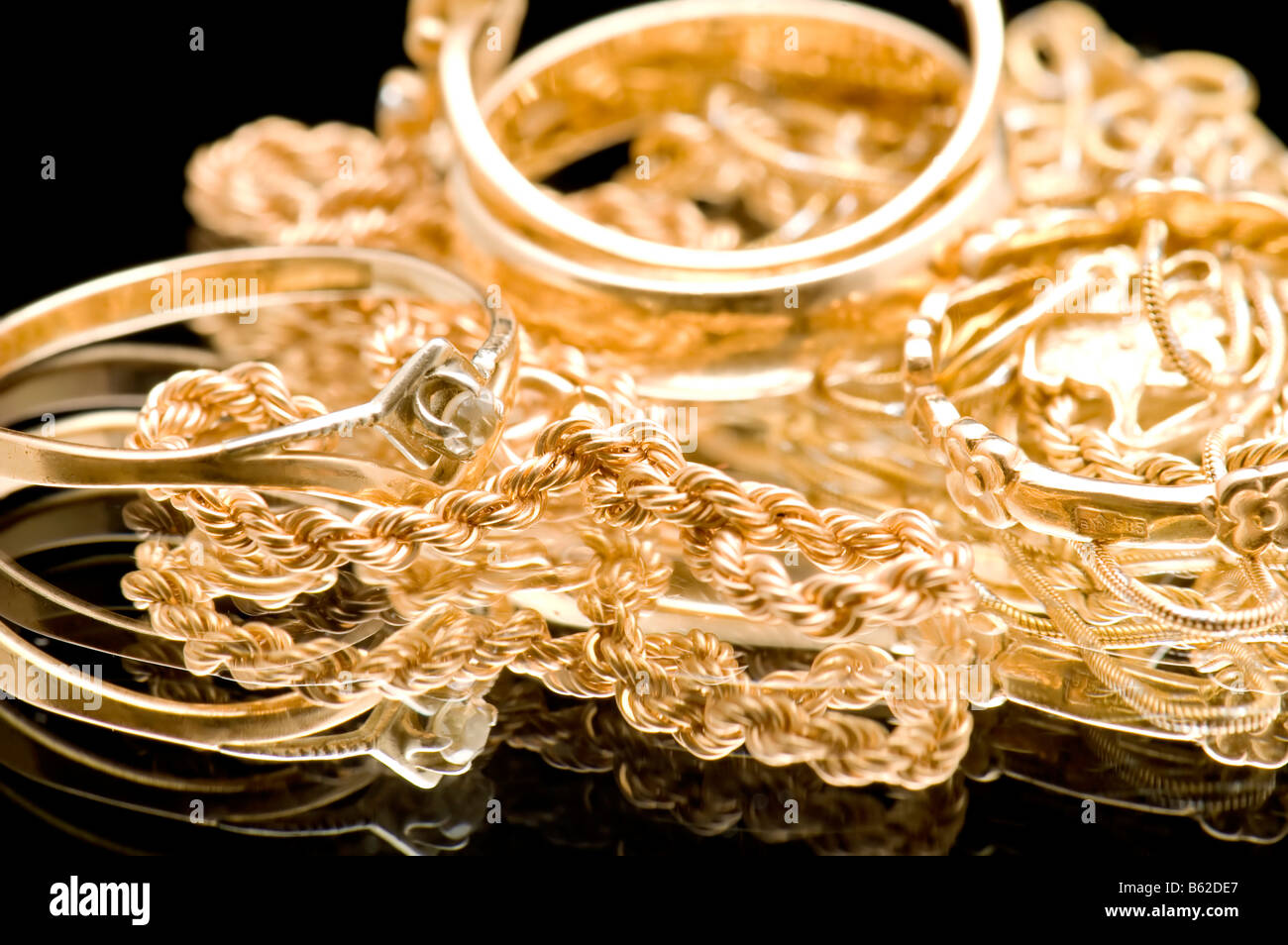 object on black Gold valuable on black Stock Photo - Alamy