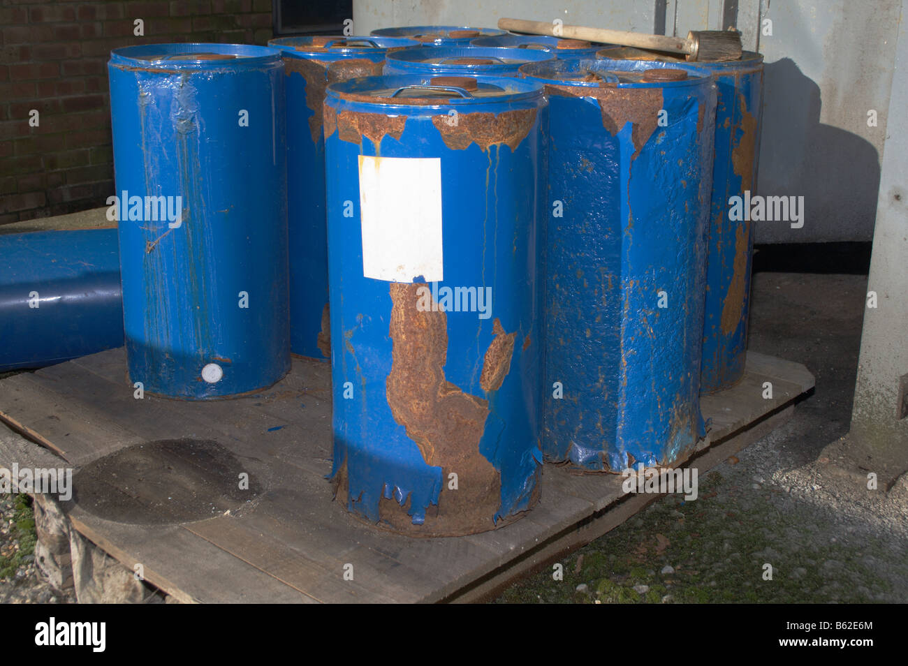 Rusting cans leaking solvent Stock Photo - Alamy
