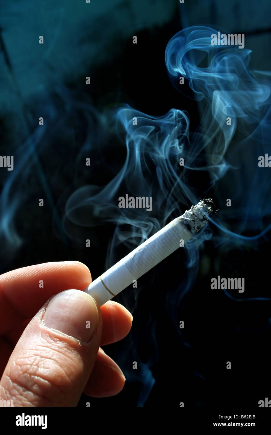 A smoking cigarette Stock Photo - Alamy