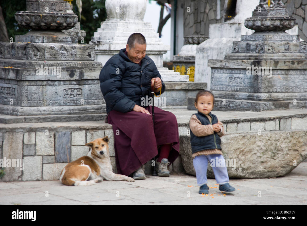 Monk and boy at the Buddhist temple of Swayambhunath the monkey temple ...