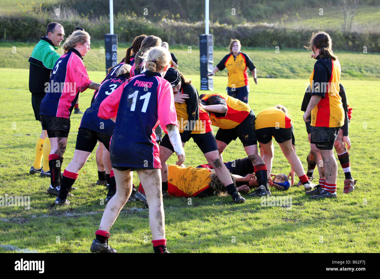 Teenage girls playing Rugby on a cold wet autumn afternoon Stock Photo ...