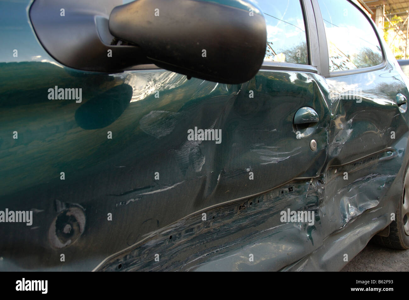 Dented and scratched panels on a motor car Stock Photo - Alamy