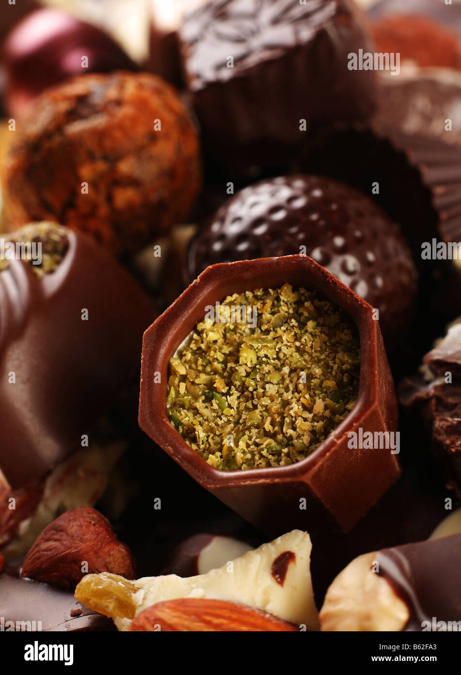 Chocolate candy group detail background with nut Stock Photo - Alamy