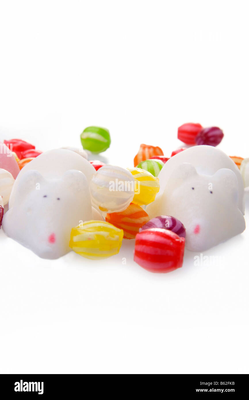 Candy sugar mice and colorful hard sweets on white background Stock ...
