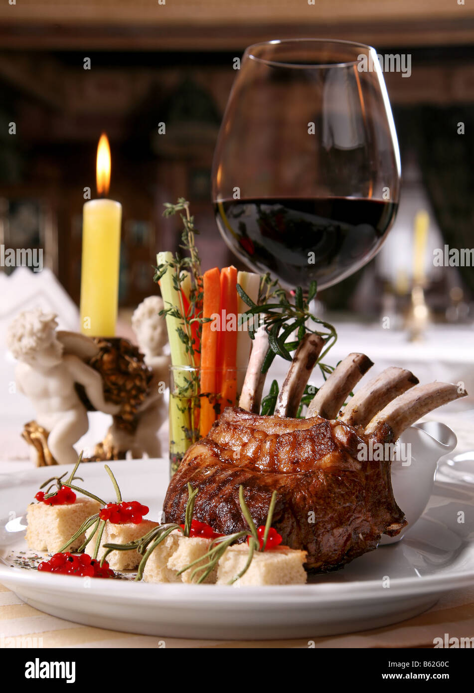 Dinner in restaurant with flaming candle and wine Stock Photo - Alamy