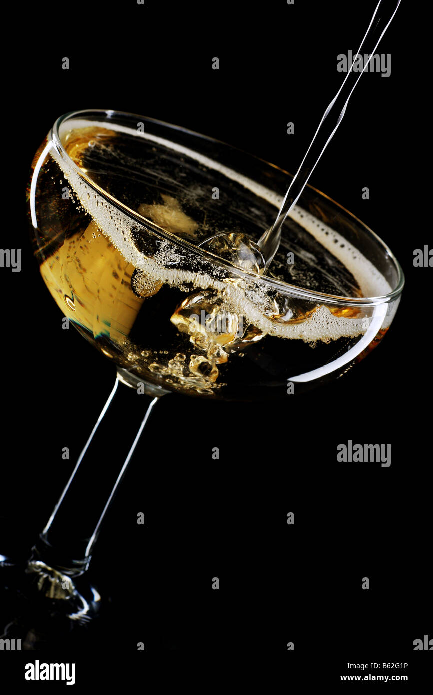 champagne coupe glass with champagne flow Stock Photo - Alamy