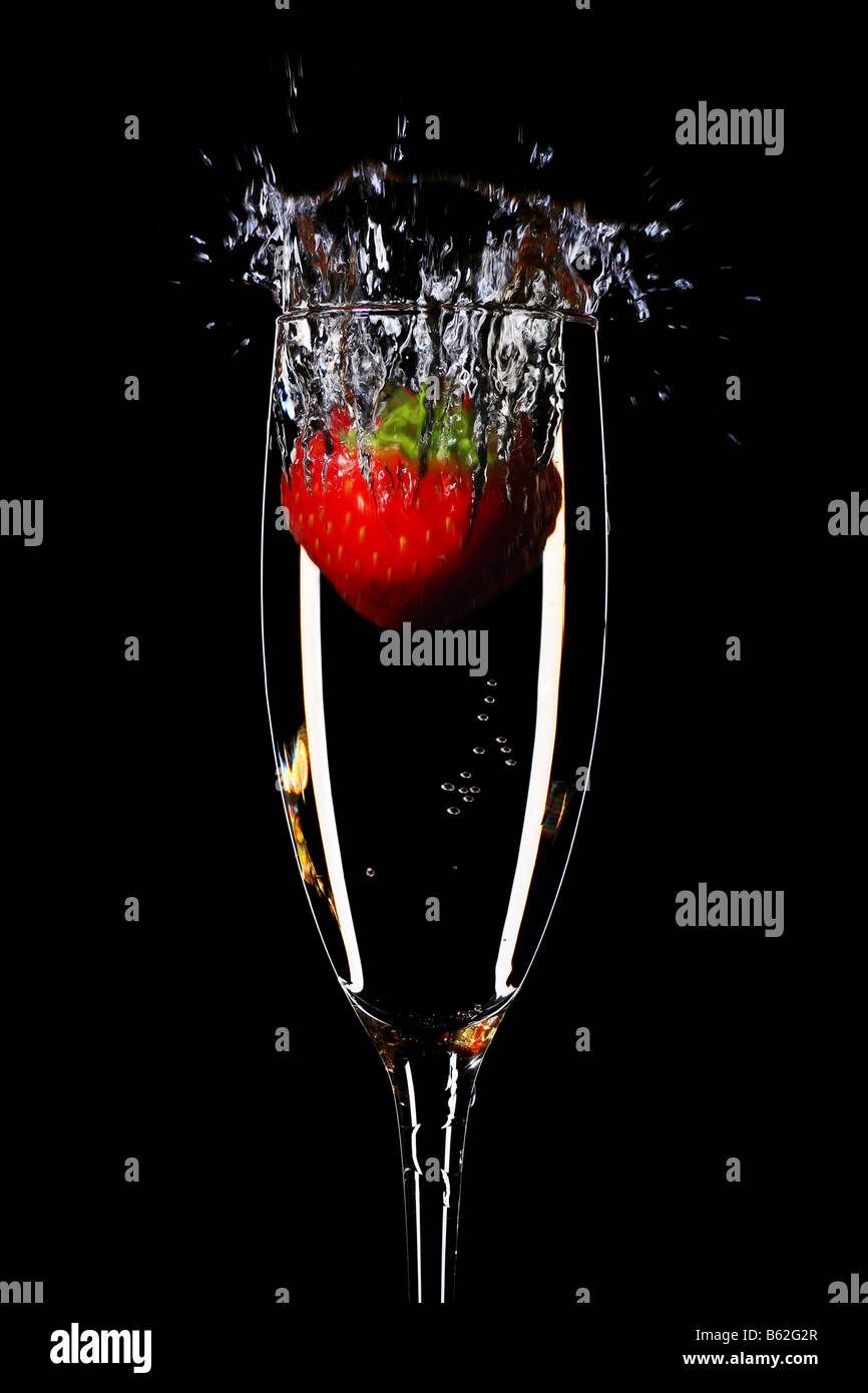 strawberry splash in a champagne flute Stock Photo - Alamy