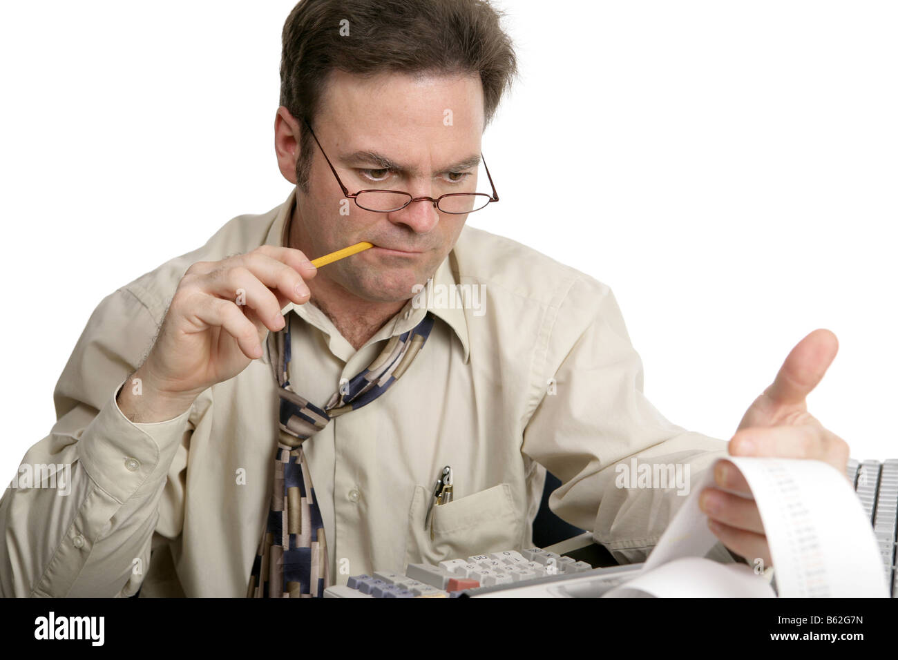 An accountant concentrating on his calculations Isolated on white Stock ...