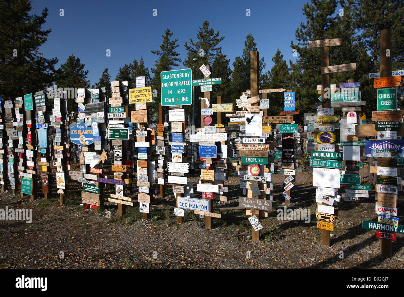 Sign posts forest in Watson Lake Yuko Stock Photo - Alamy