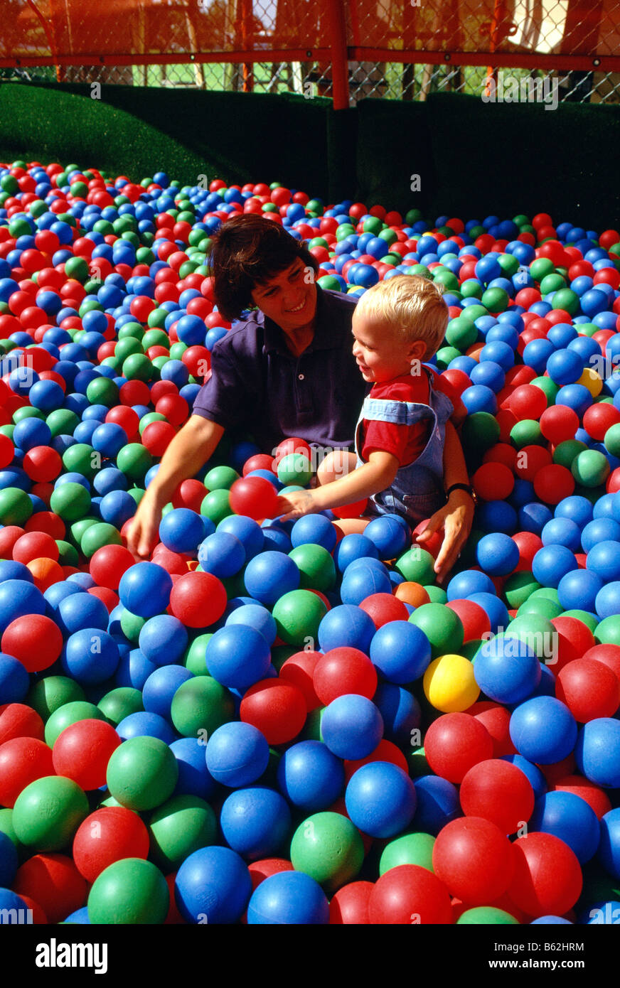 Children & adults playing in the 'Snuffleballs' at Sesame Place, a ...