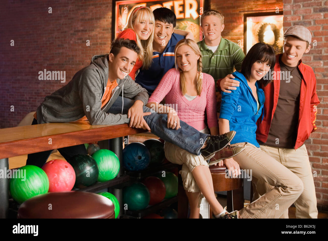 Portrait of a group of friends smiling Stock Photo - Alamy