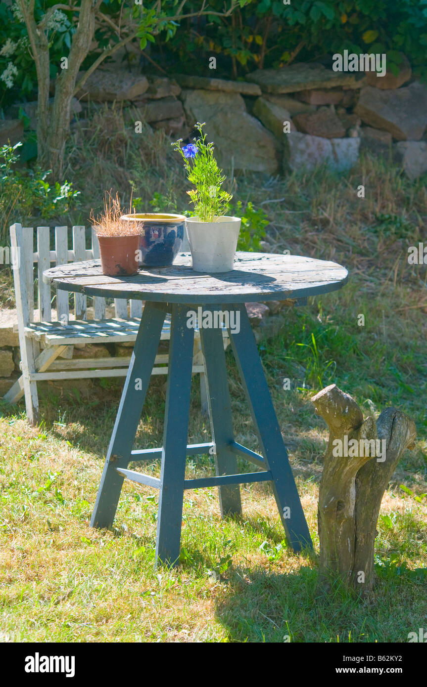 Garden table with flowers Stock Photo - Alamy