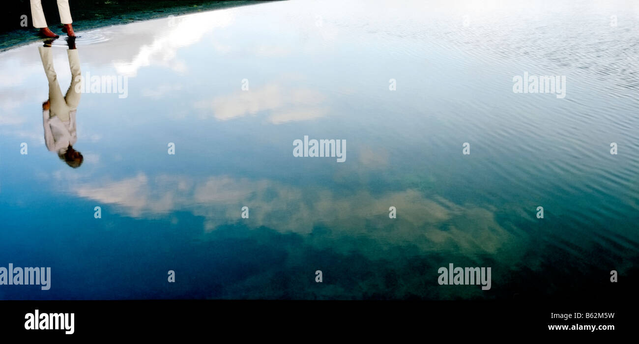 Reflection of a man in water, Iceland Stock Photo - Alamy
