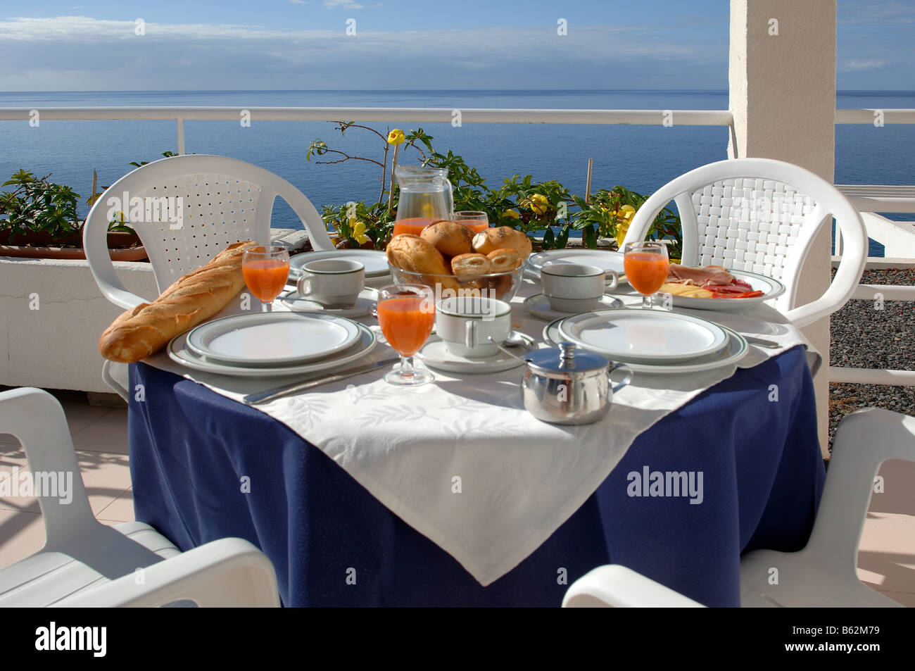 Breakfast table in sunshine Stock Photo - Alamy