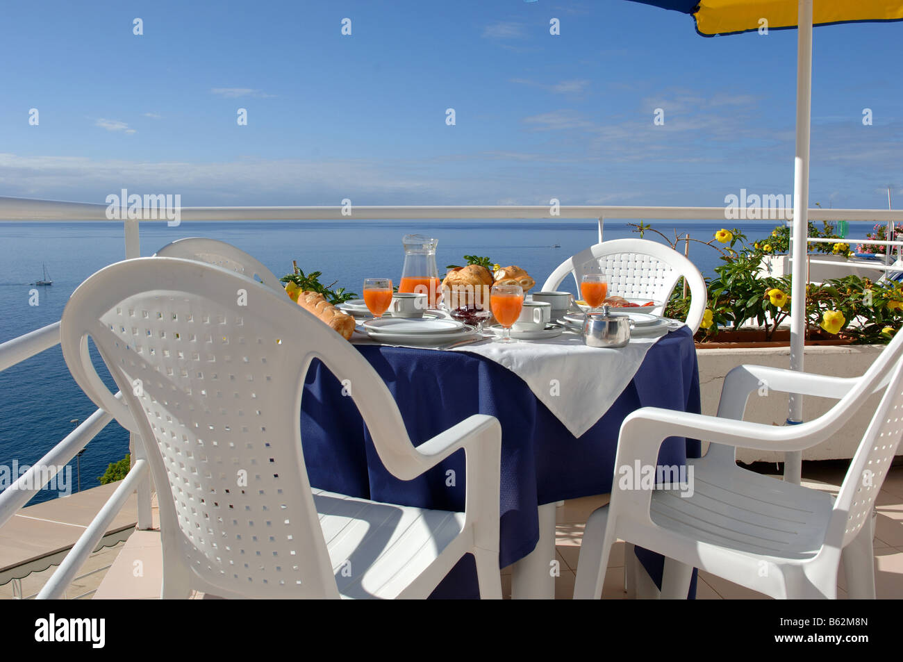 Breakfast table in sunshine Stock Photo - Alamy