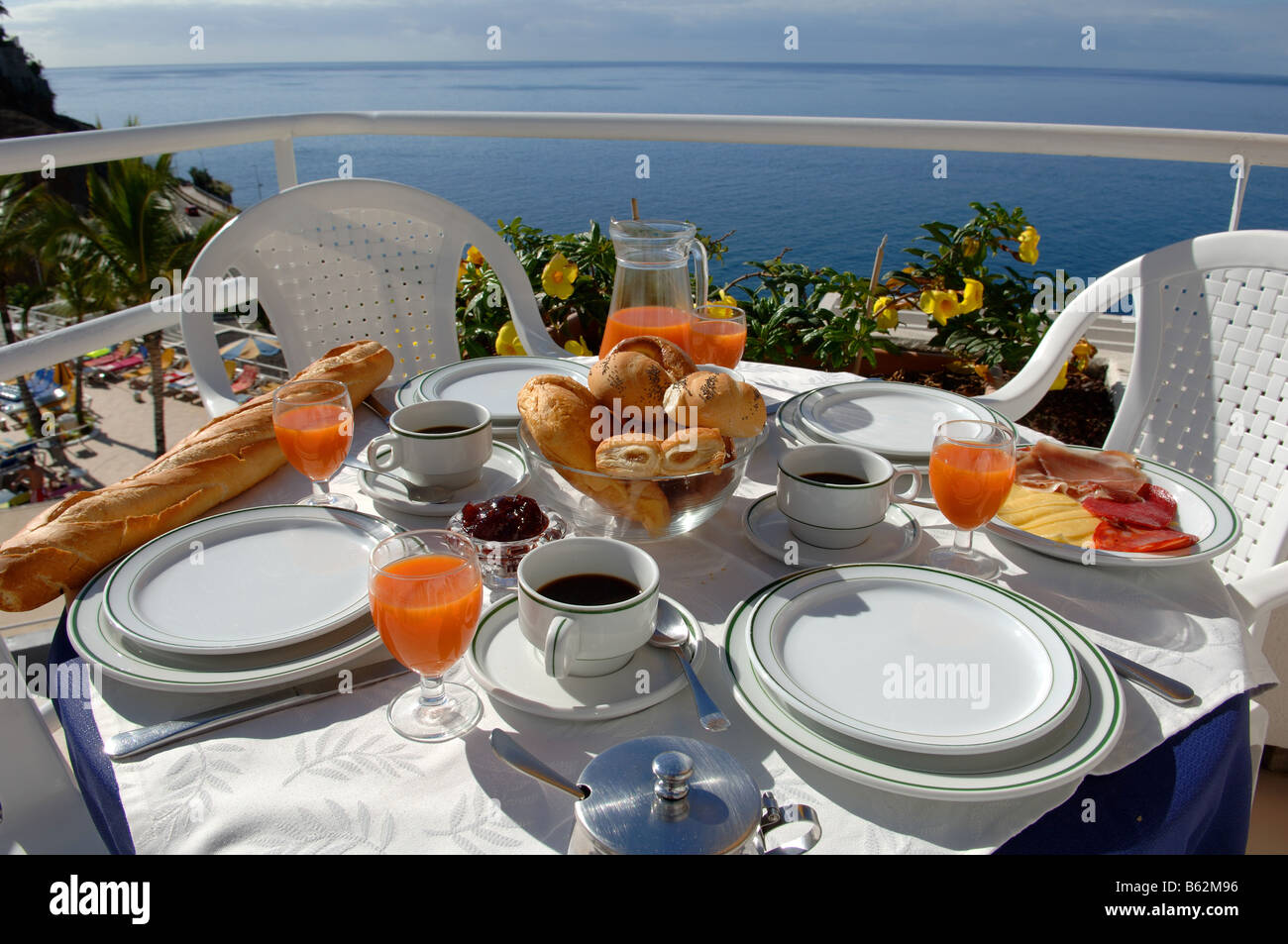 Breakfast table in sunshine Stock Photo - Alamy