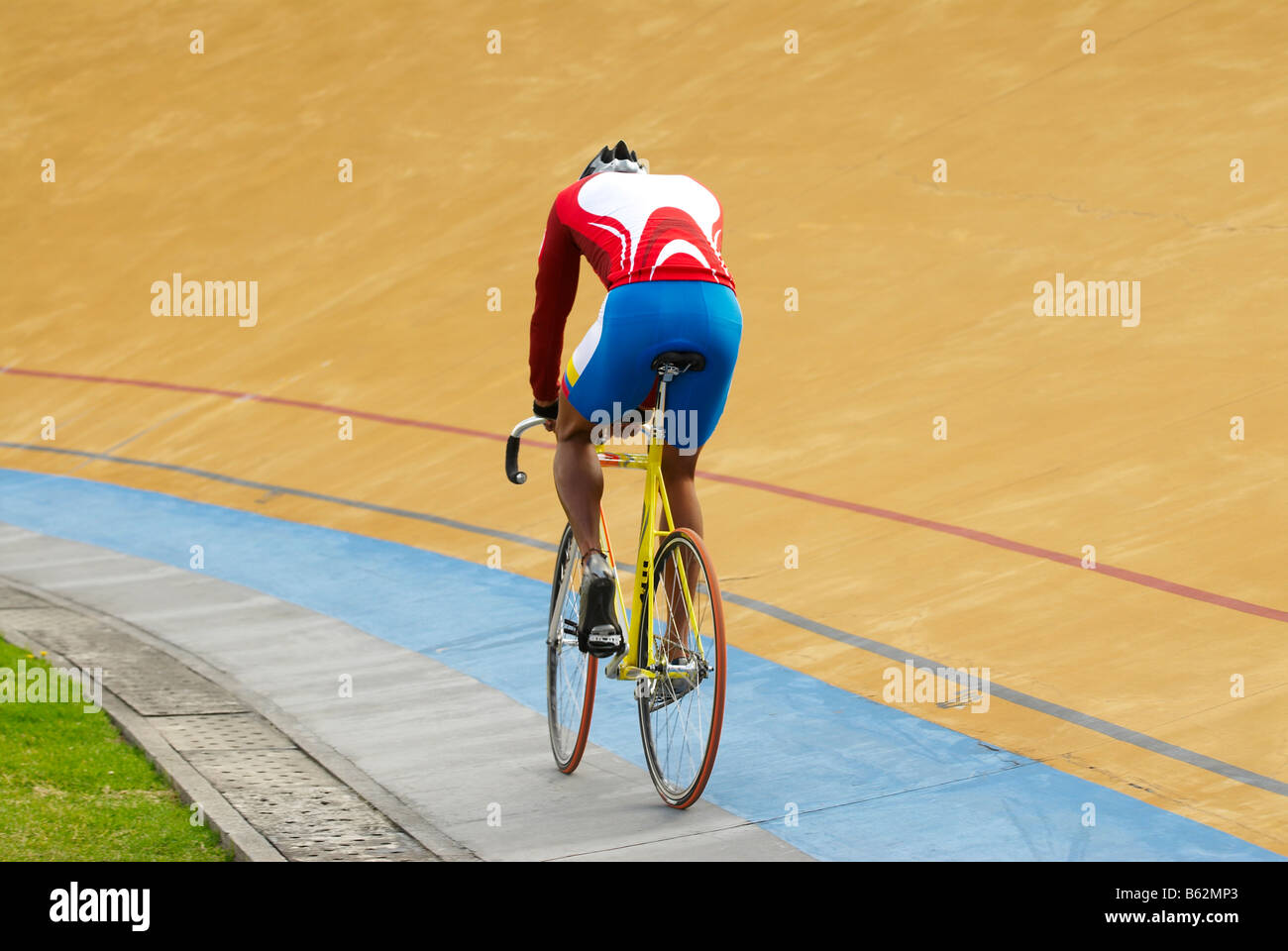 Rear view of a cyclist racing in velodrome Stock Photo - Alamy