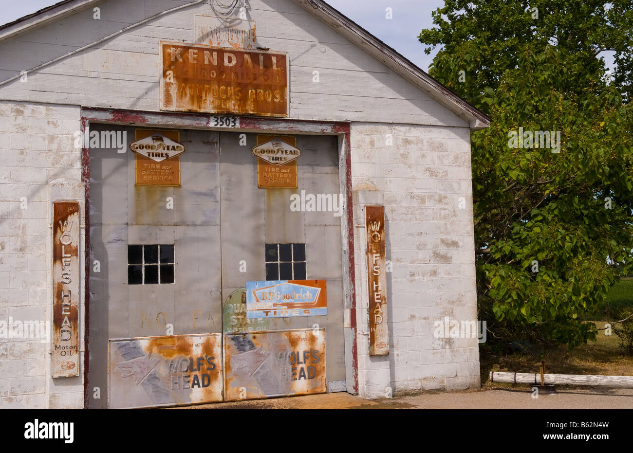 Old beat up and worn garage with rust in small town on coast of ...