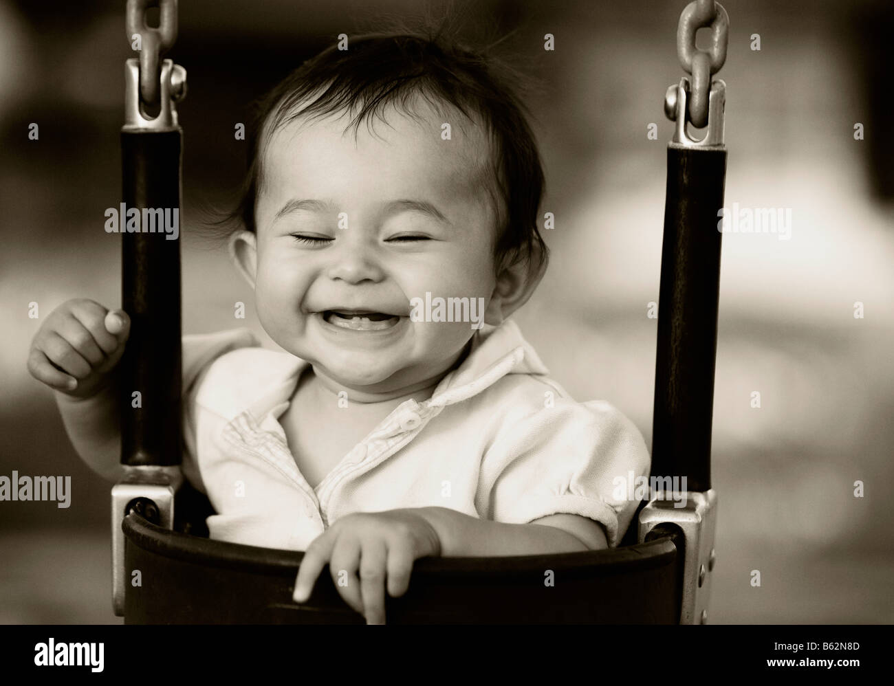 Baby eyes shut sitting up hi-res stock photography and images - Alamy