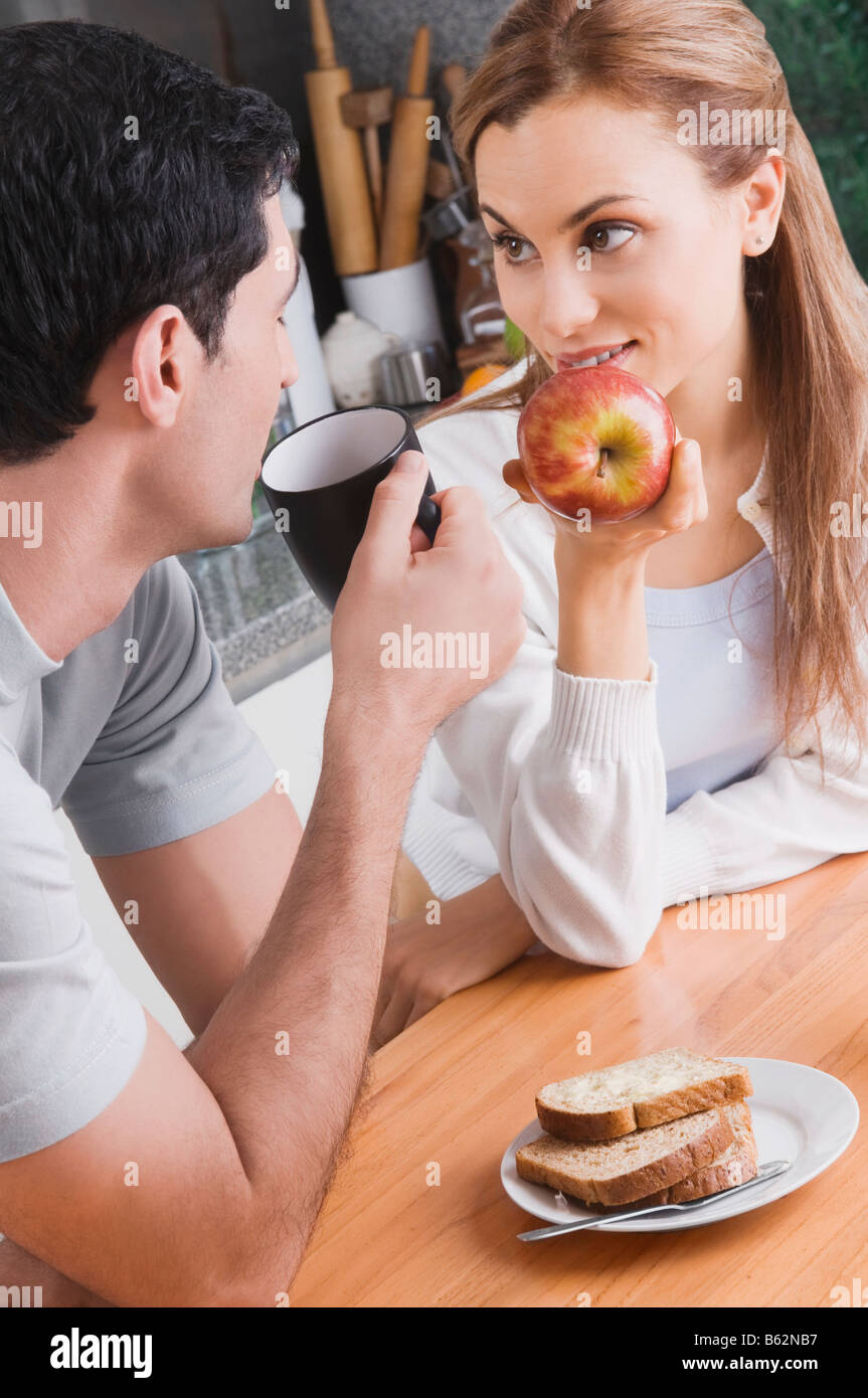 Mid adult couple having breakfast Stock Photo - Alamy