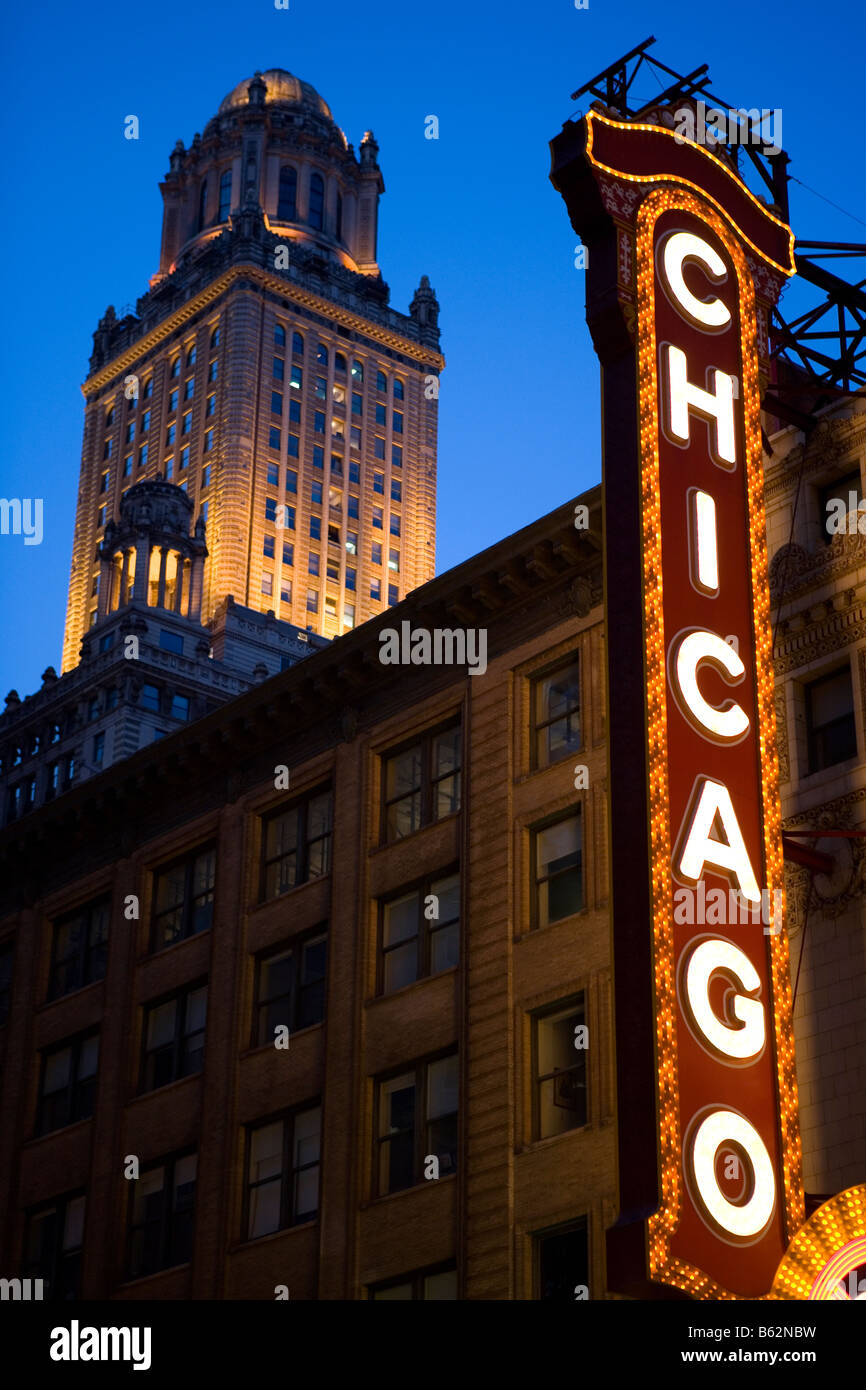 Low angle view of Chicago neon sign lit up at dusk, Chicago Theatre ...