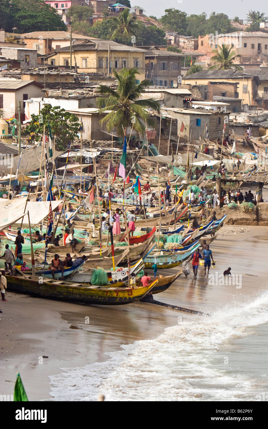 Traditional fishing boats docked on the beach in Cape Coast, Ghana ...