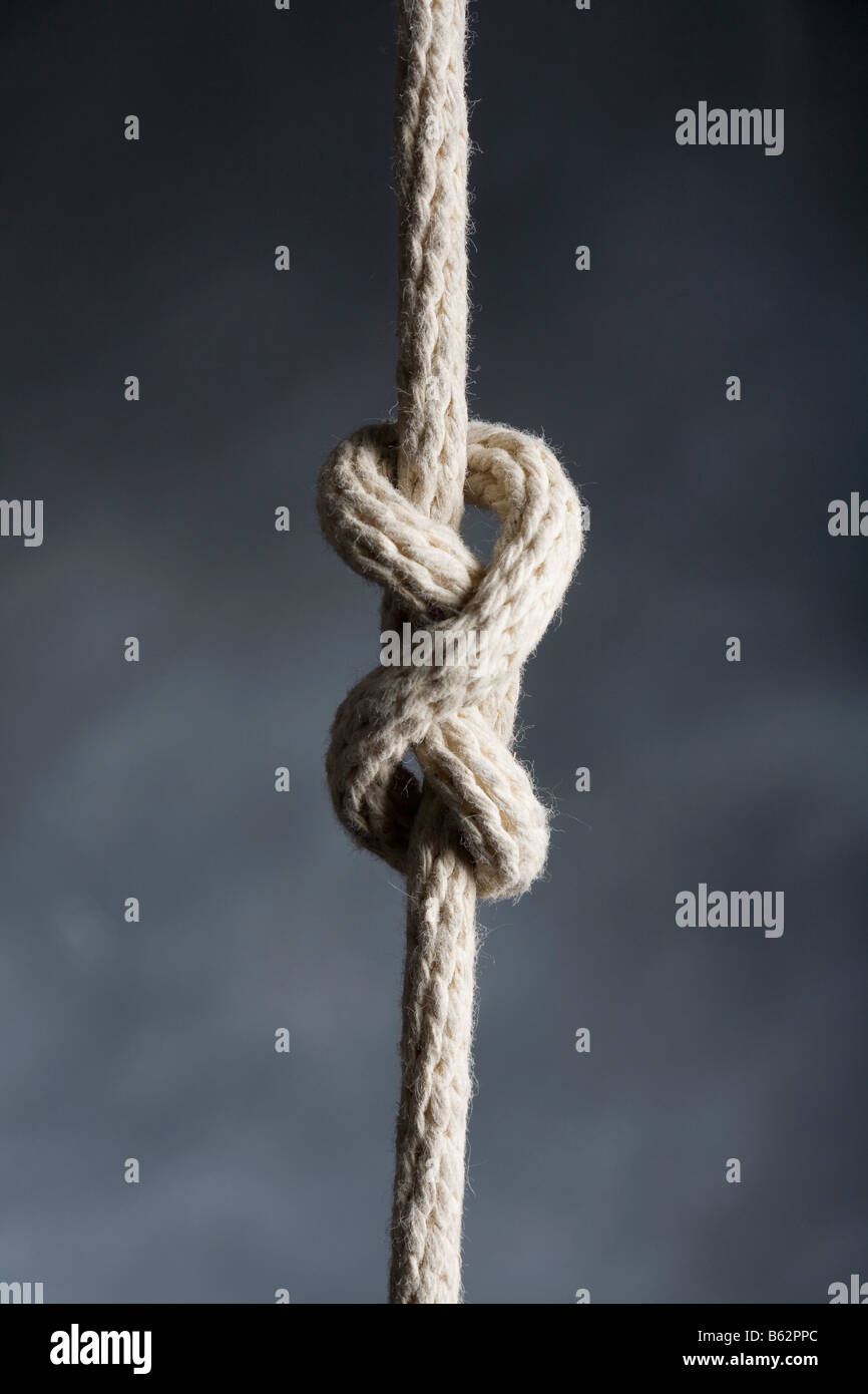 Close-up of ropes with reef knot Stock Photo - Alamy