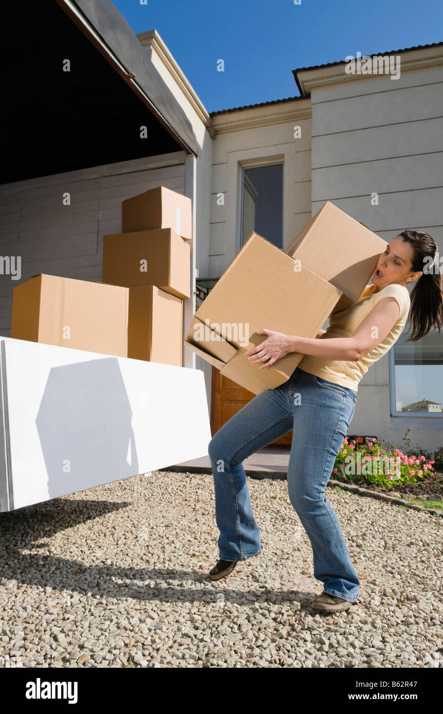 Struggle to carry boxes hi-res stock photography and images - Alamy