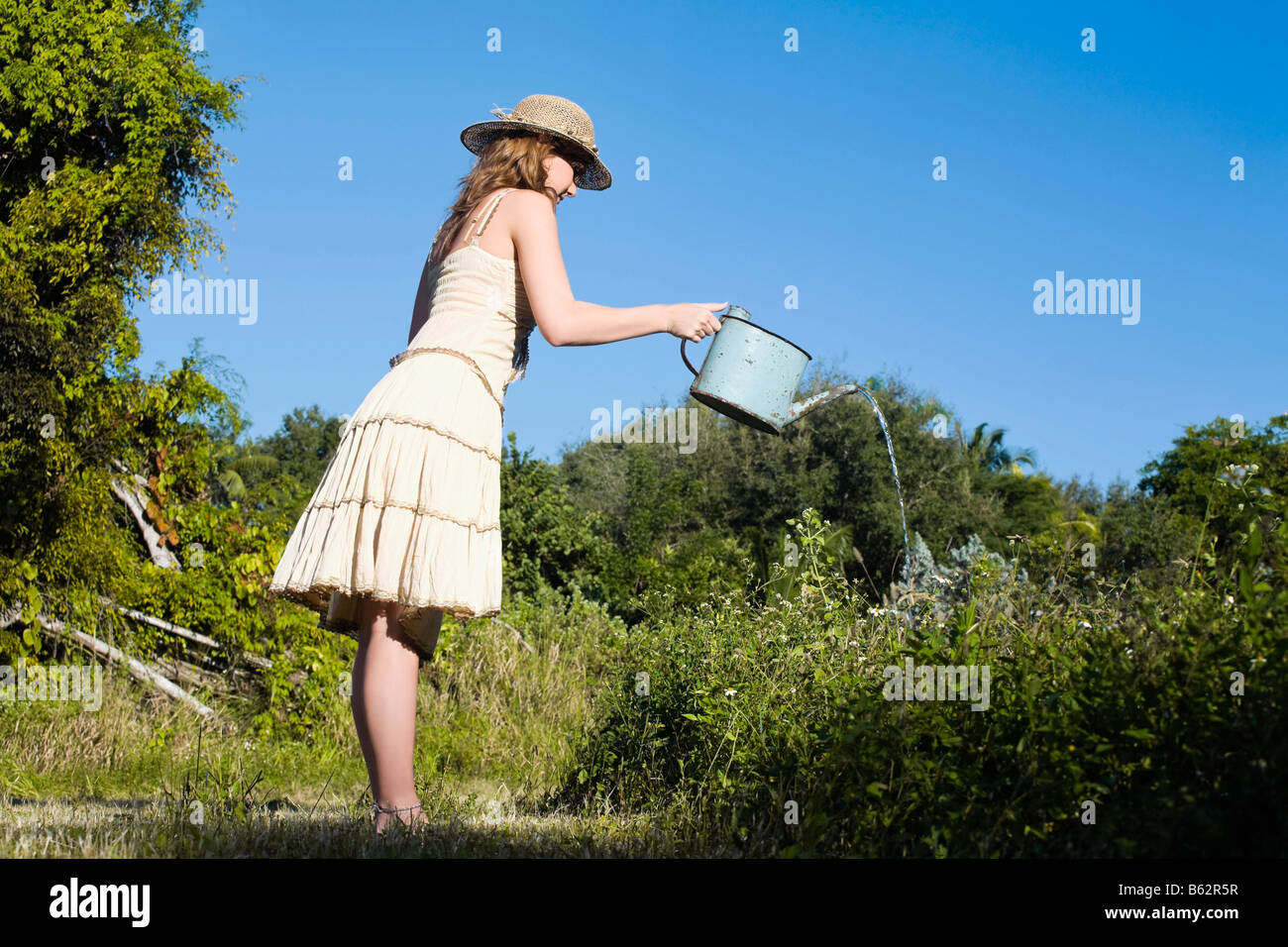 Student watering plants hi-res stock photography and images - Alamy