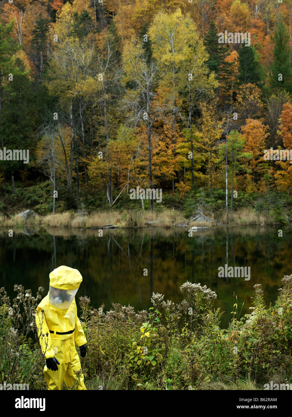 43 year old asian male in a hazmat suit and gas mask outdoors with the ...