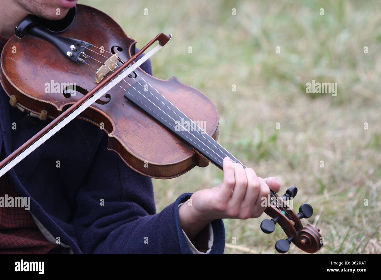 old Violin being played by a Union Soldier at a Civil War reenactment ...