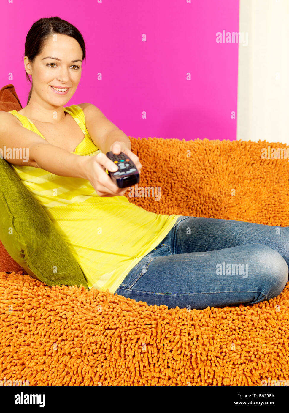 Young Woman Watching Television Model Released Stock Photo - Alamy