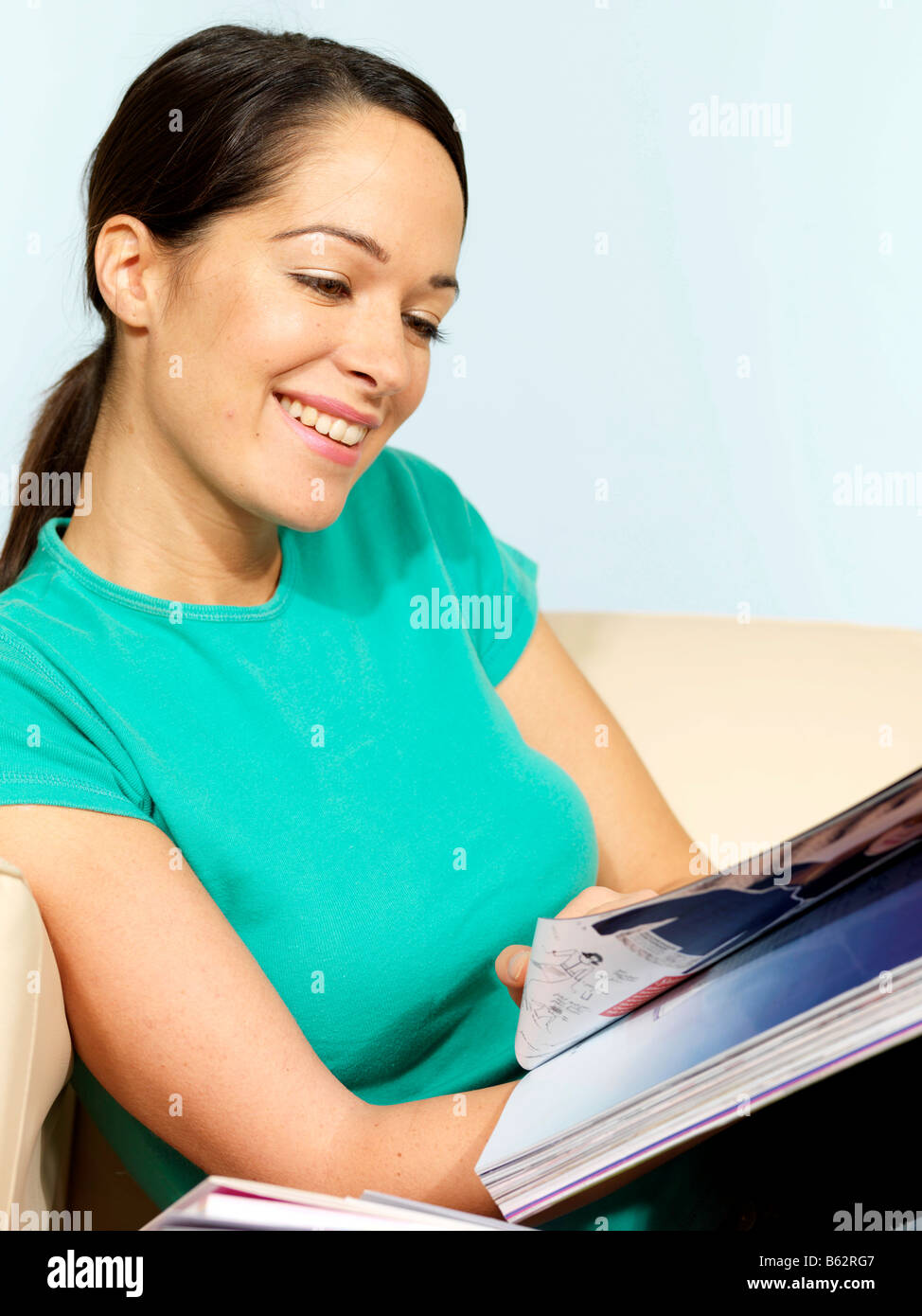 Young Woman Reading a Magazine Model Released Stock Photo - Alamy
