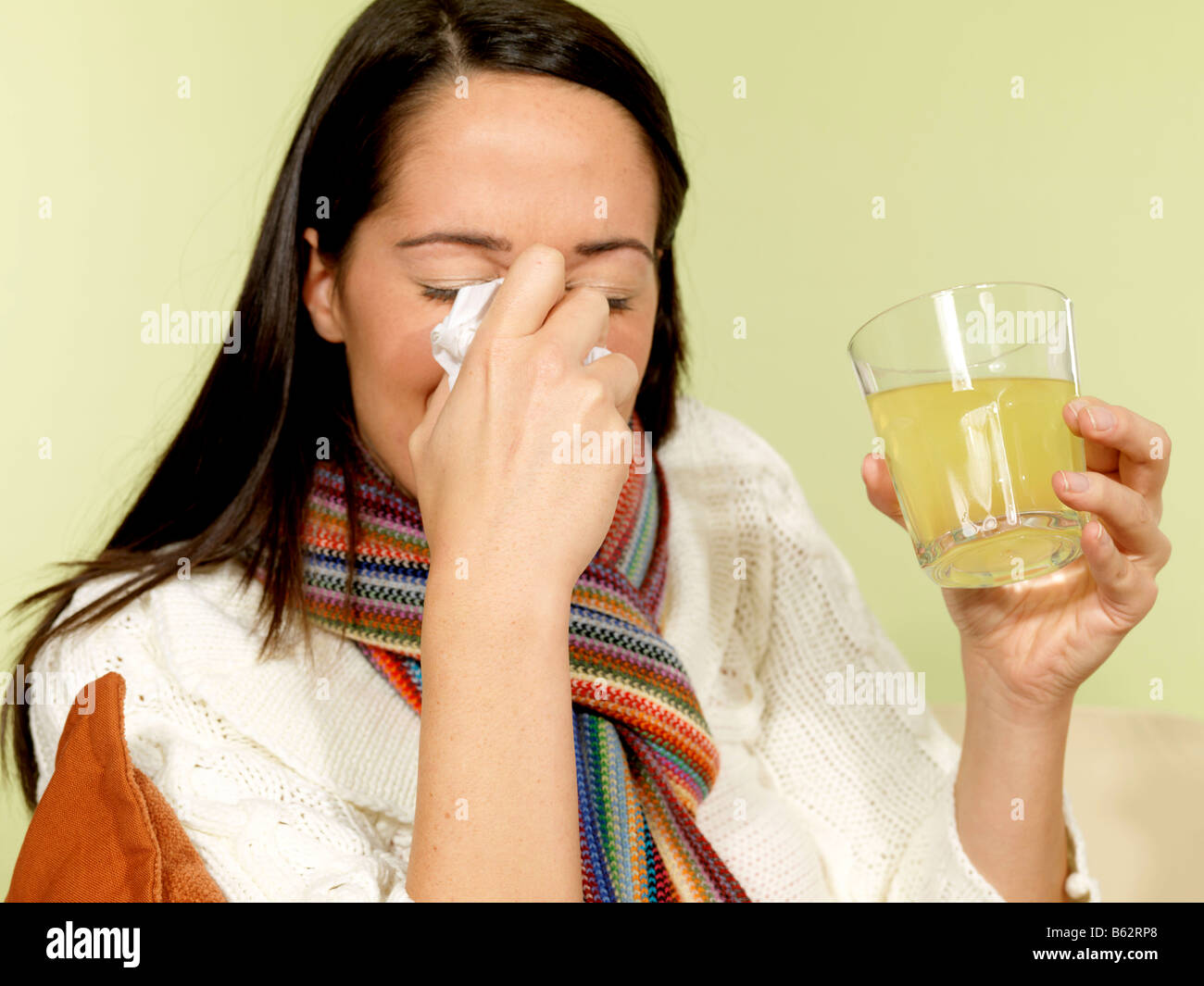 Young Woman Suffering From A Winter Cold Or Flu Taking A Glass Of ...