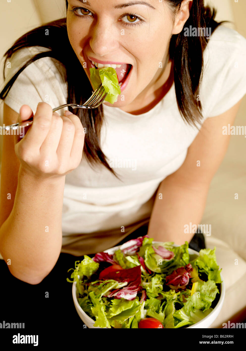 Young Woman Eating Salad Model Released Stock Photo - Alamy