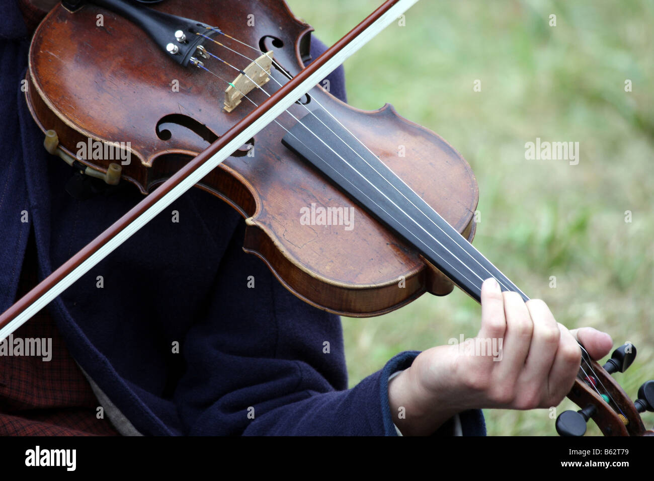 old Violin being played by a Union Soldier at a Civil War reenactment ...