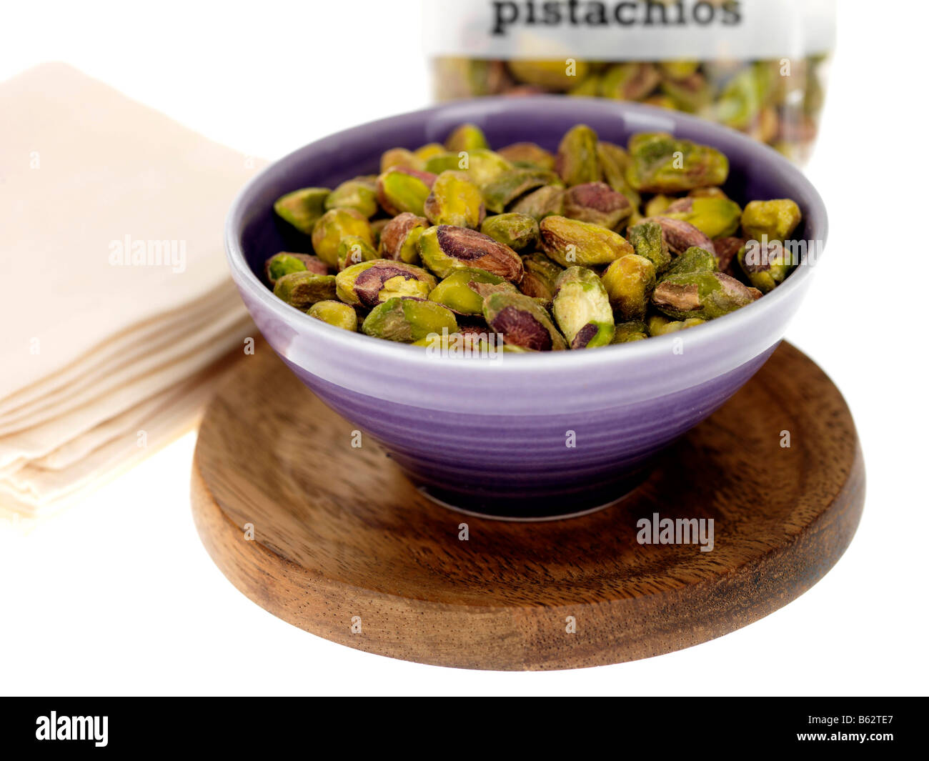 Fresh Shelled Green Pistachios Nuts In A Bowl Isolated Against A White ...