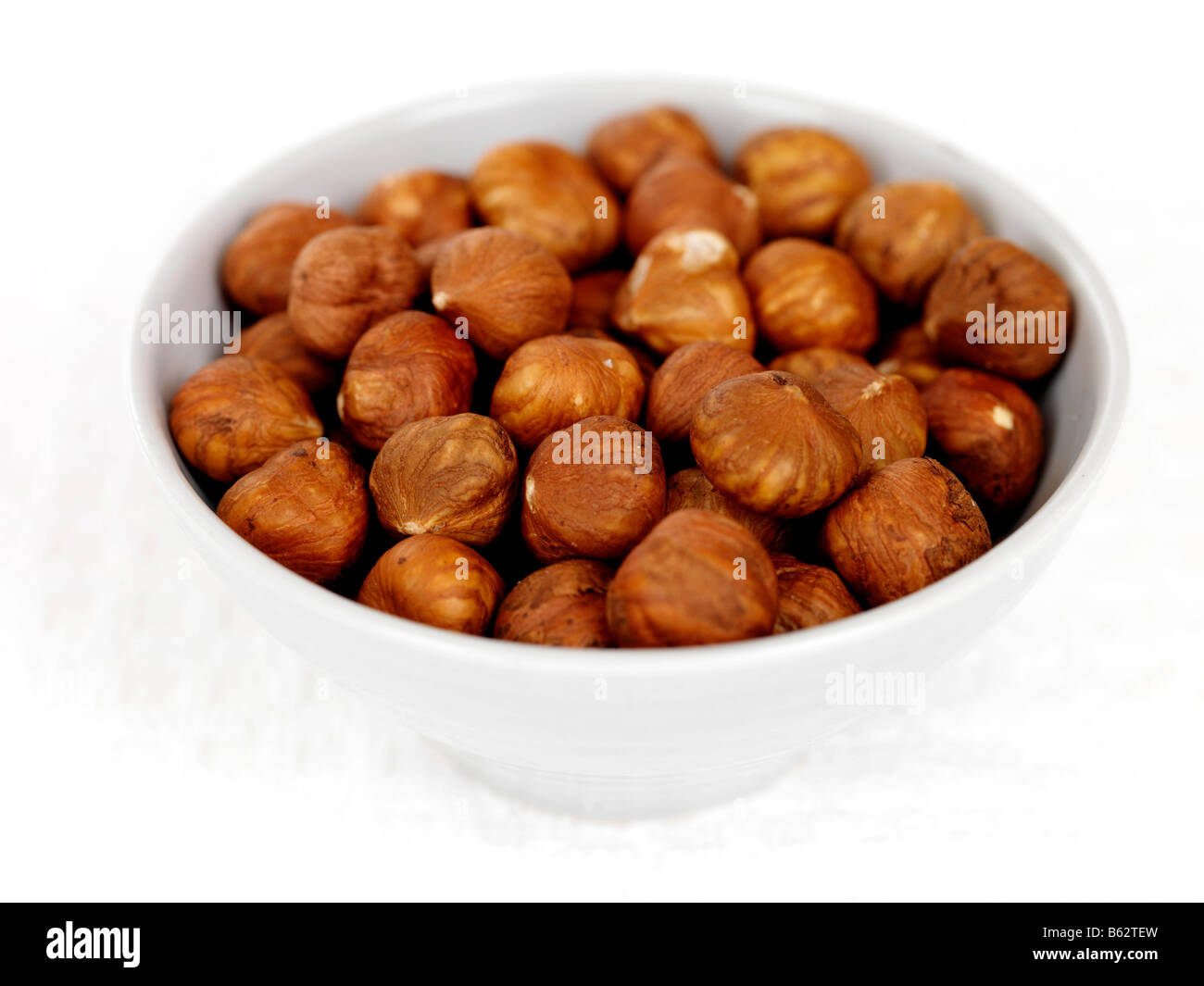 Bowl Of Fresh Healthy Hazelnuts Isolated Against A White Background ...
