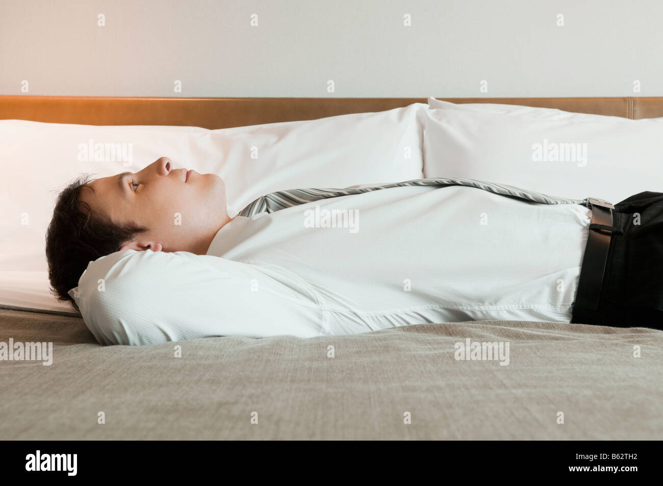 Young man dreams on bed hi-res stock photography and images - Alamy