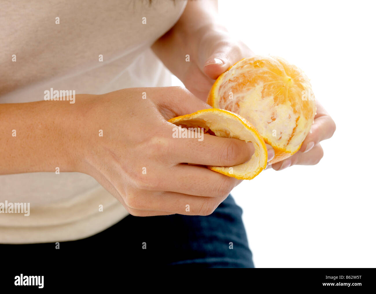 Woman Peeling An Orange Model Released Stock Photo - Alamy