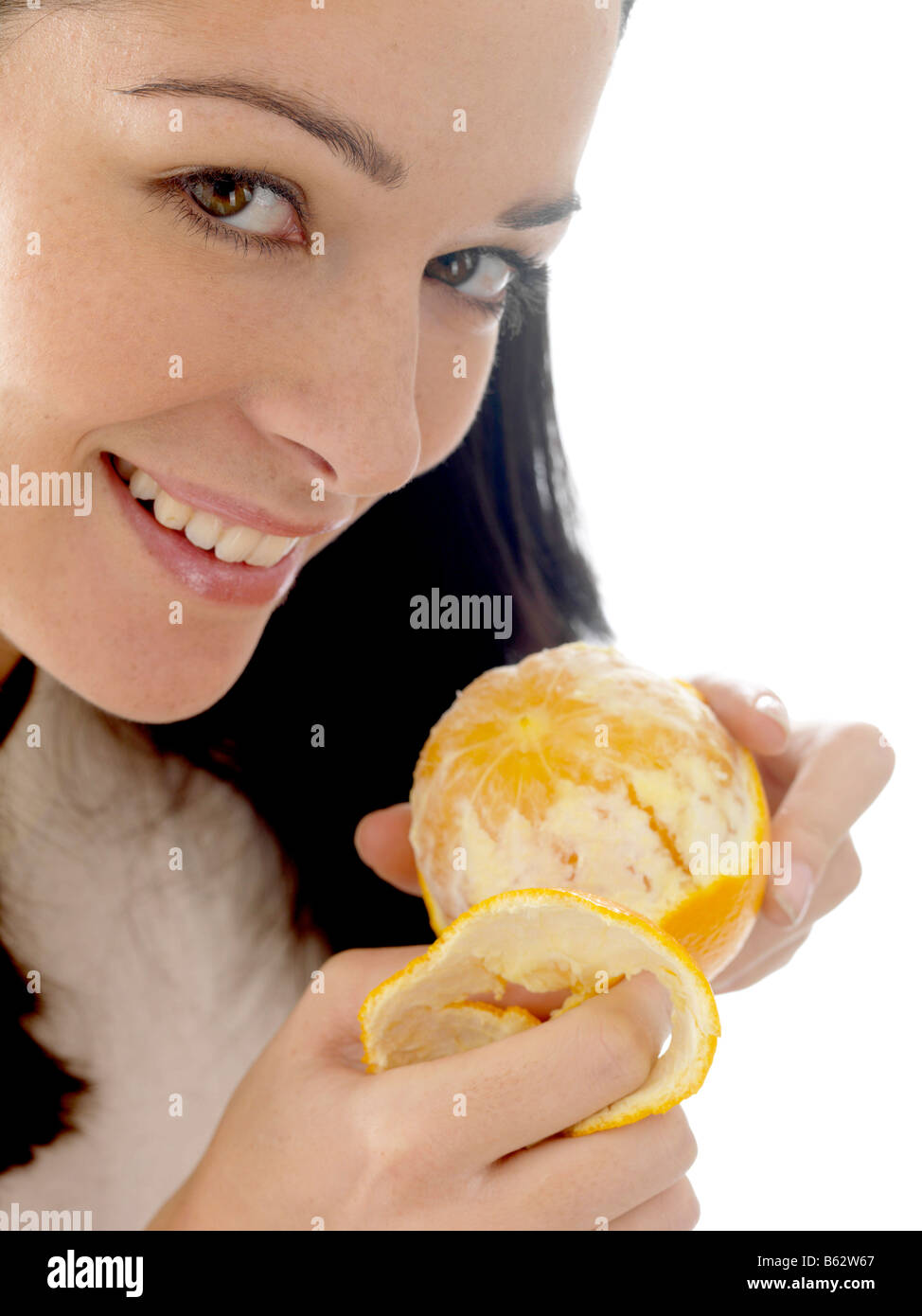 Woman Peeling An Orange Model Released Stock Photo - Alamy
