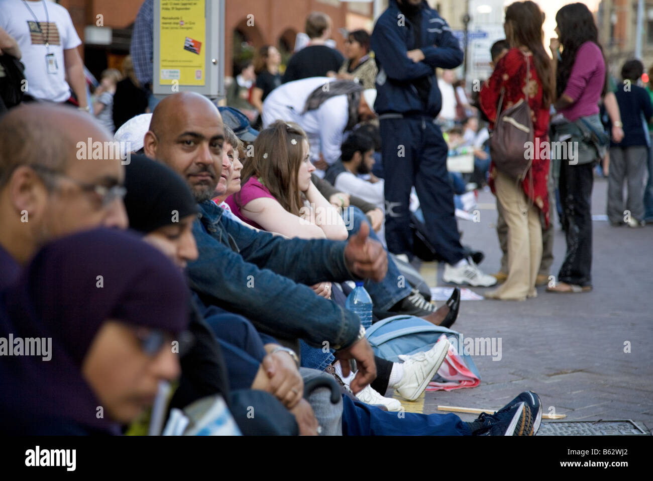 Row of Seated People Stock Photo - Alamy