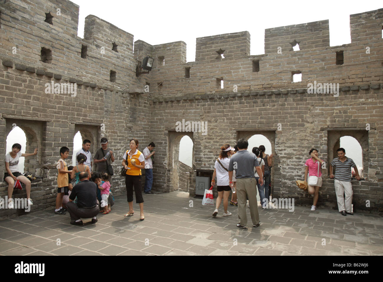 People standing inside a turret on the Great Wall of China Stock Photo ...