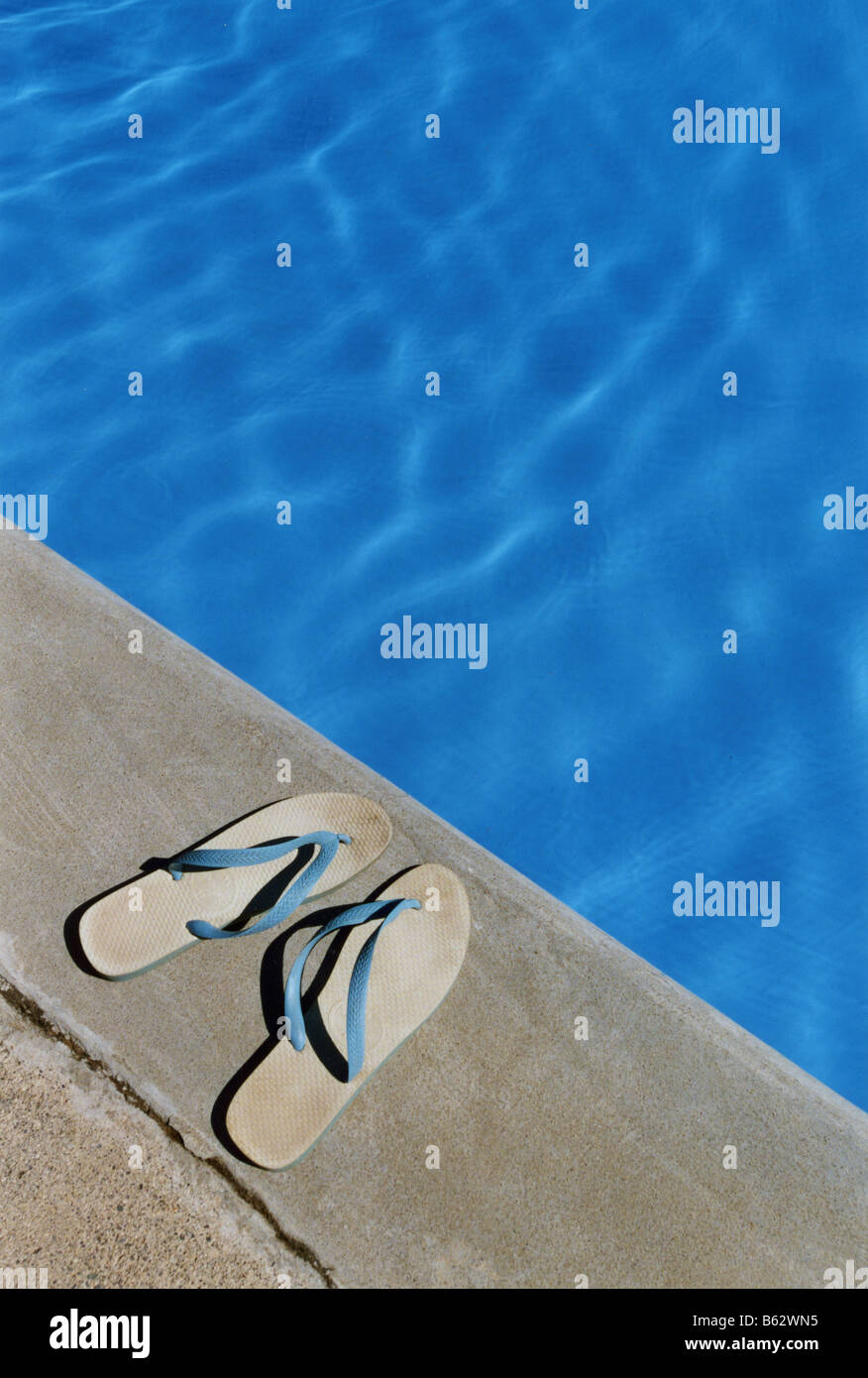 Swimming Pool, flip-flops next to Pool Stock Photo - Alamy