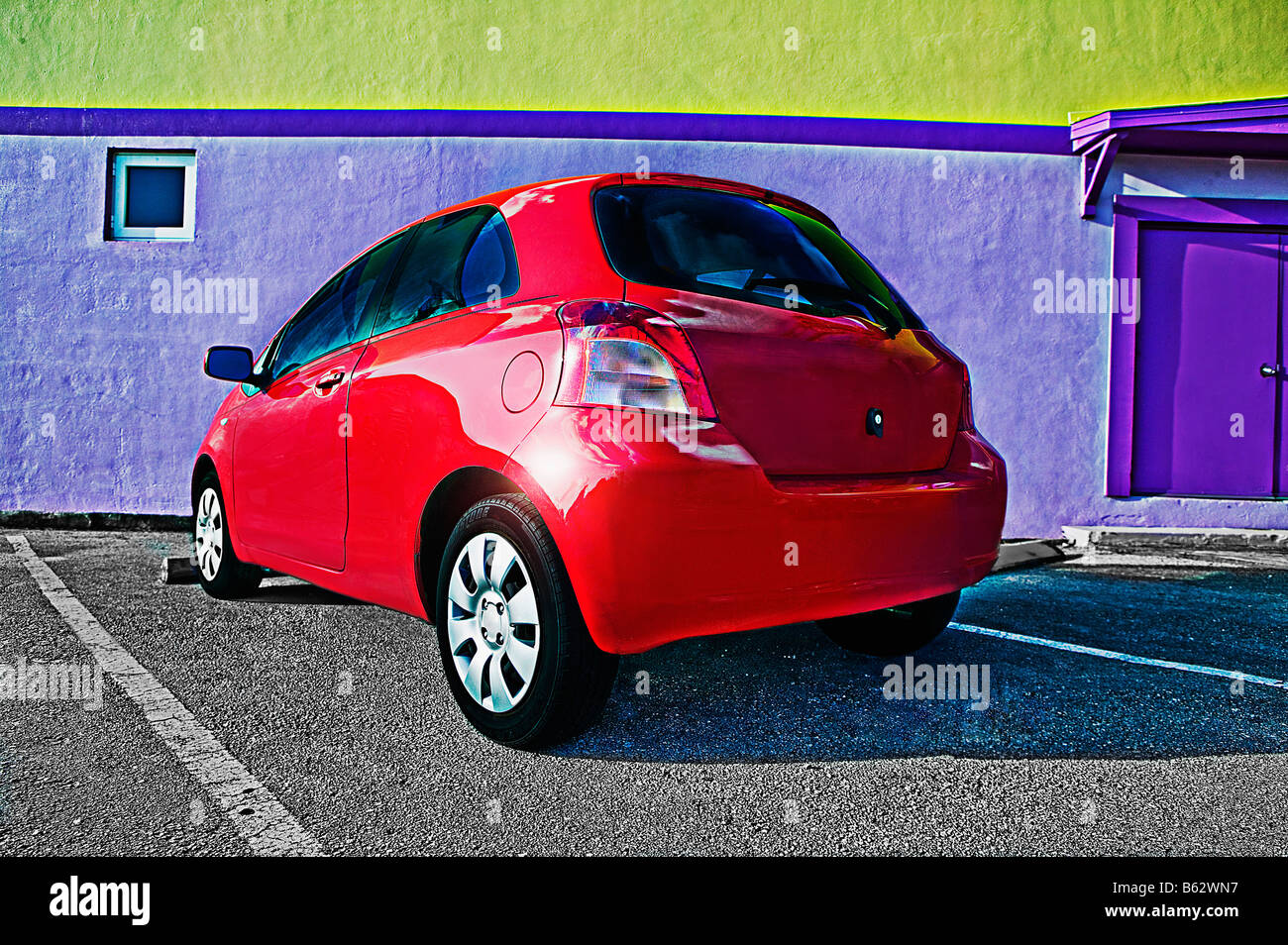 Car parked in front of a building Stock Photo - Alamy