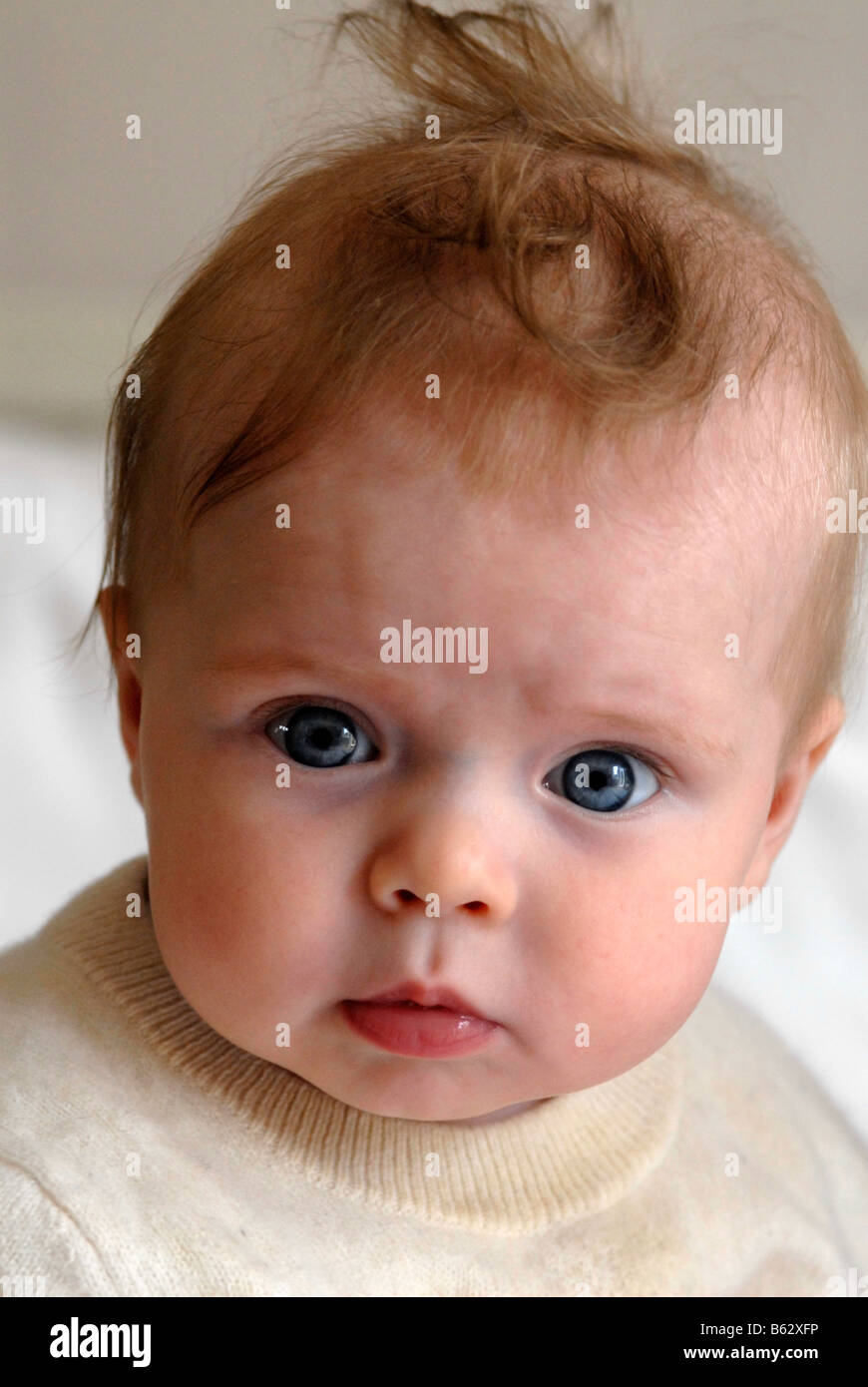 Portrait of a wide eyed baby boy Stock Photo - Alamy