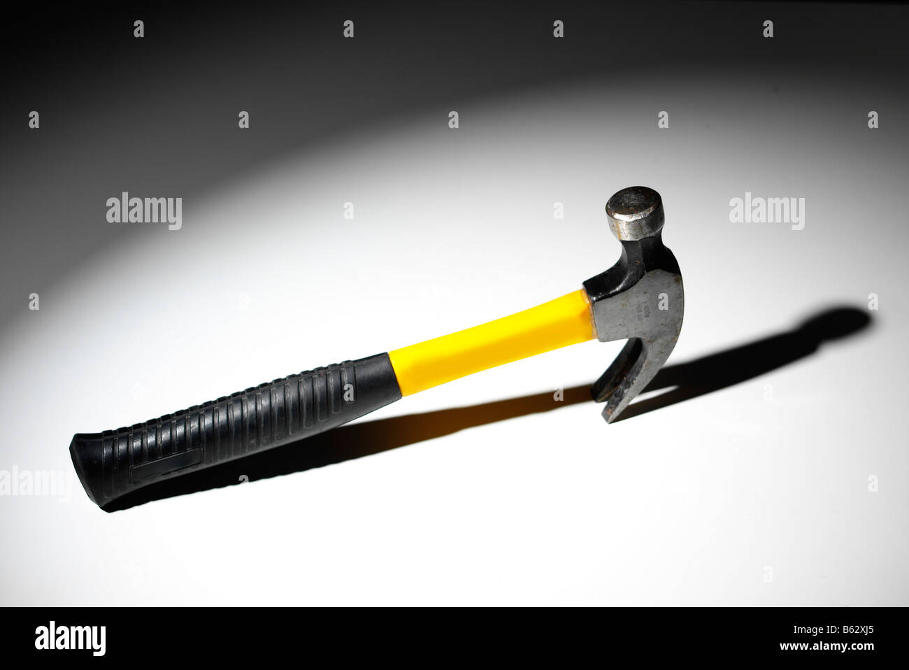Claw hammer with strong shadow background Stock Photo - Alamy