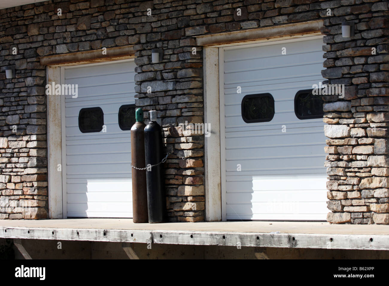 Unusual brick work on the exterior of a building with freight doors in ...