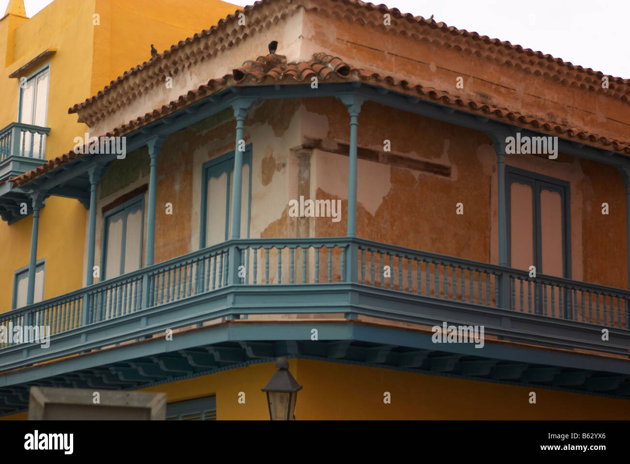 Cuban building or architecture with balcony and shuttered windows, old ...
